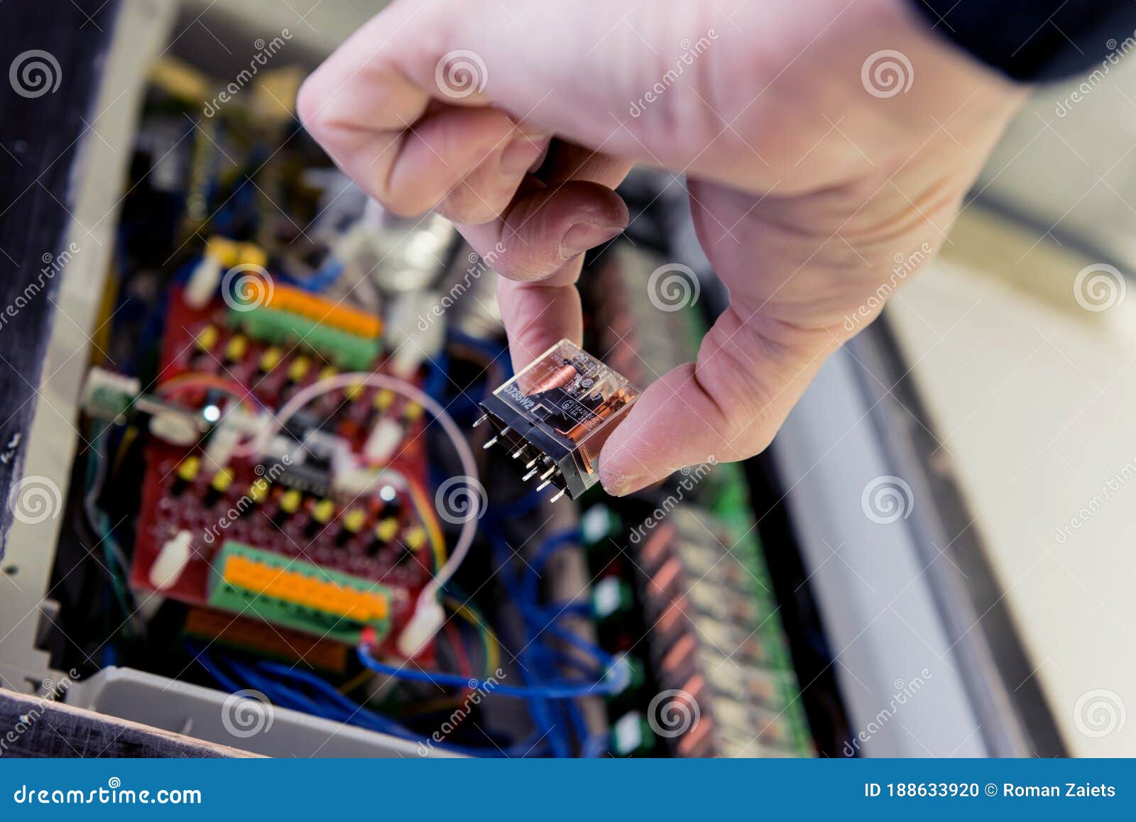 The Man is Repairing the Switchboard Voltage with Automatic Switches ...