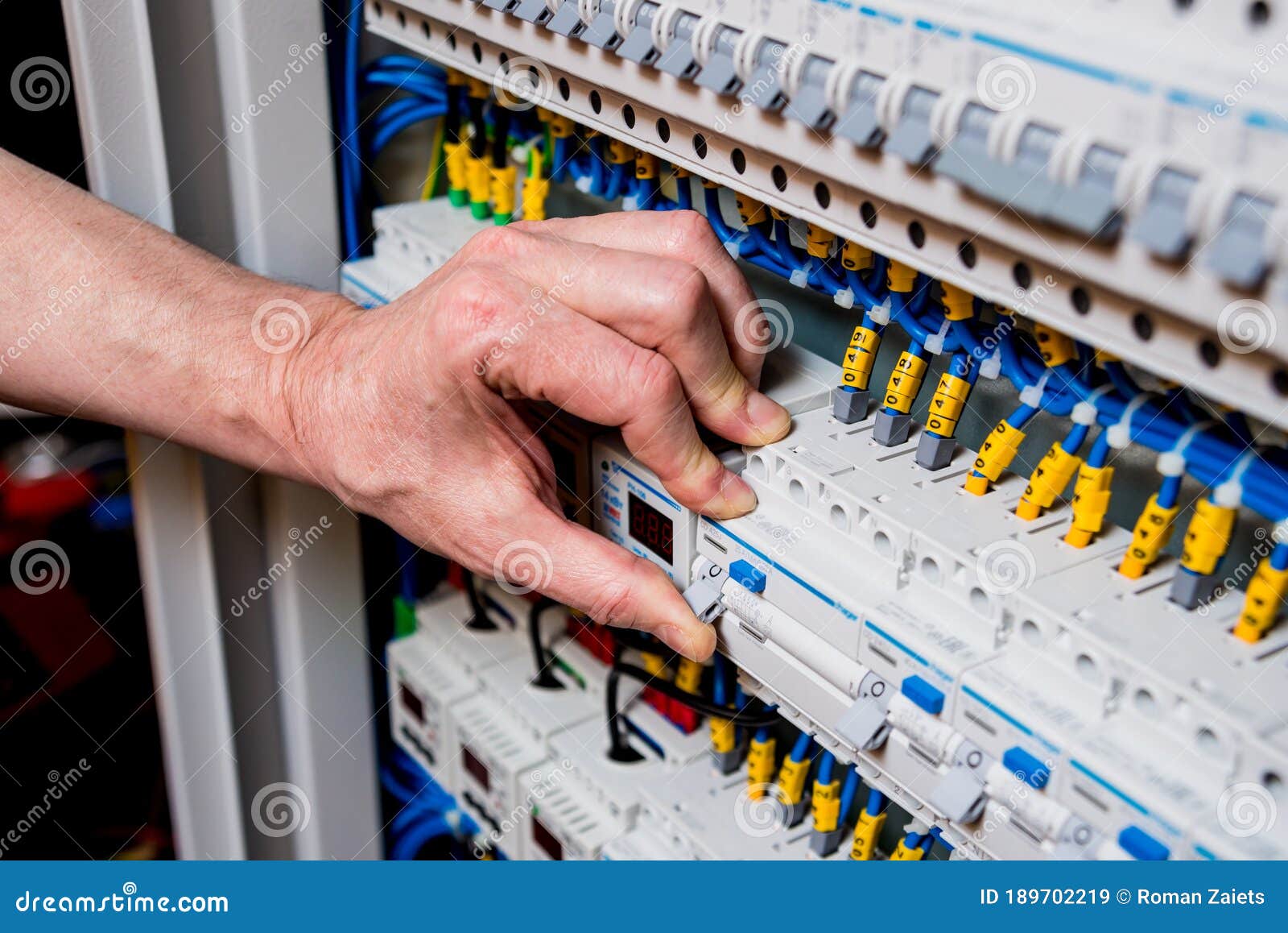 The Man is Repairing the Switchboard Voltage with Automatic Switches ...