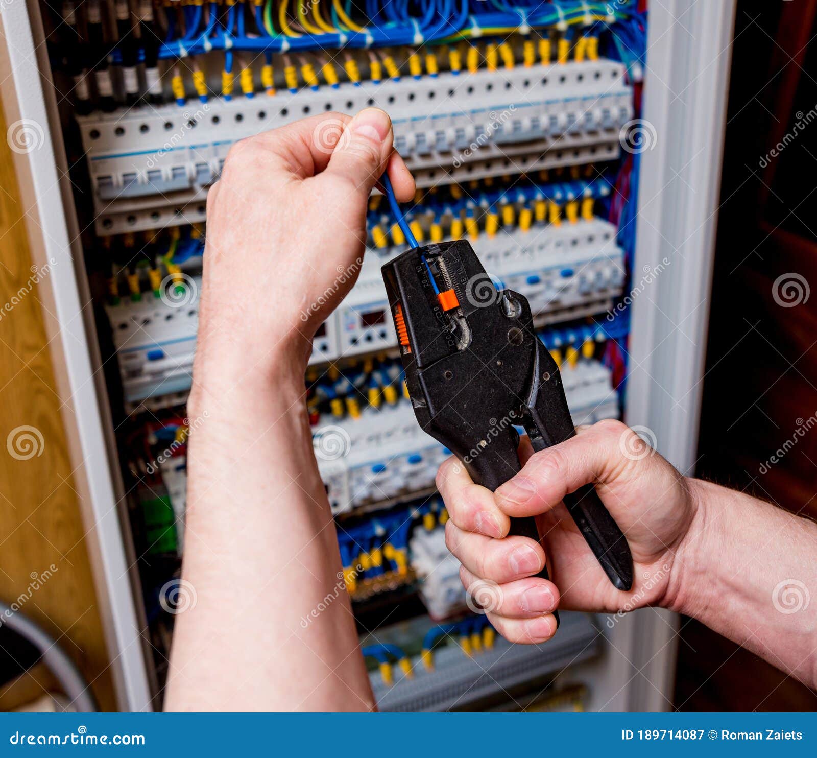 The Man is Repairing the Switchboard Voltage with Automatic Switches ...