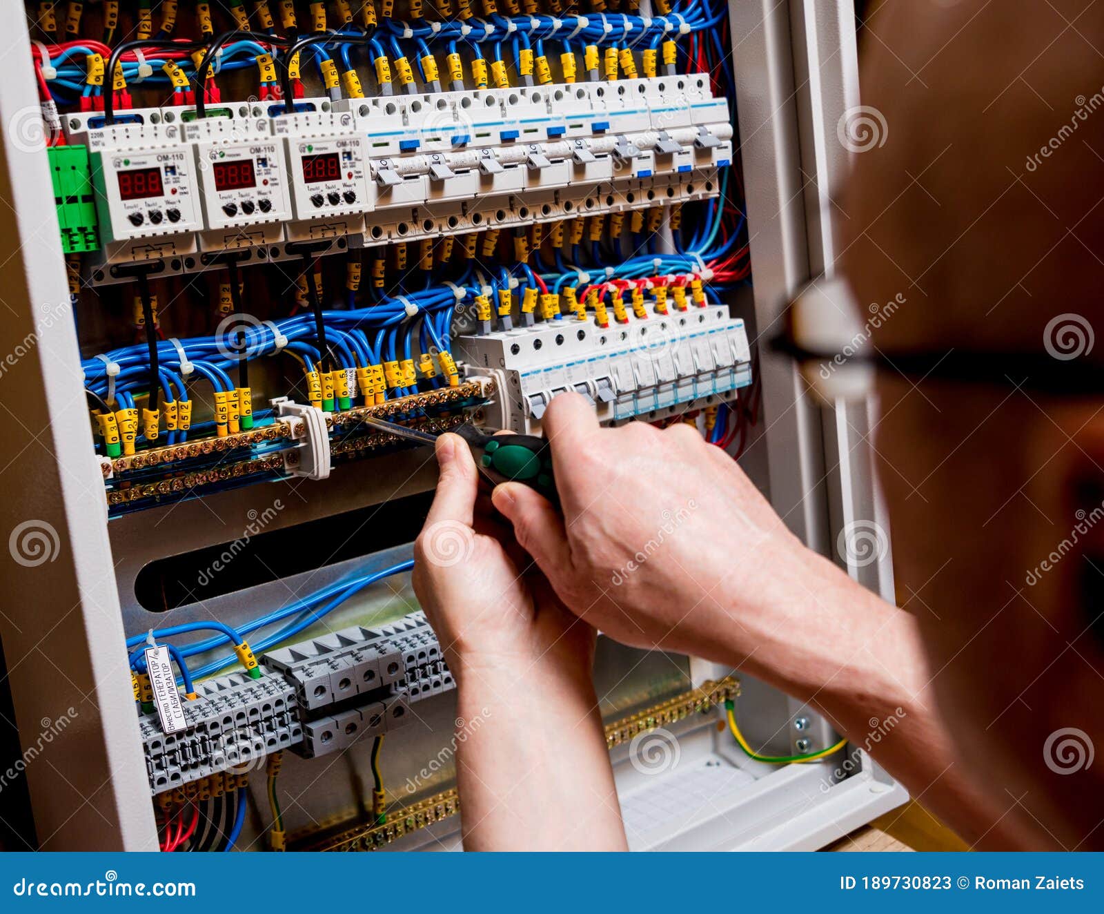 The Man is Repairing the Switchboard Voltage with Automatic Switches ...