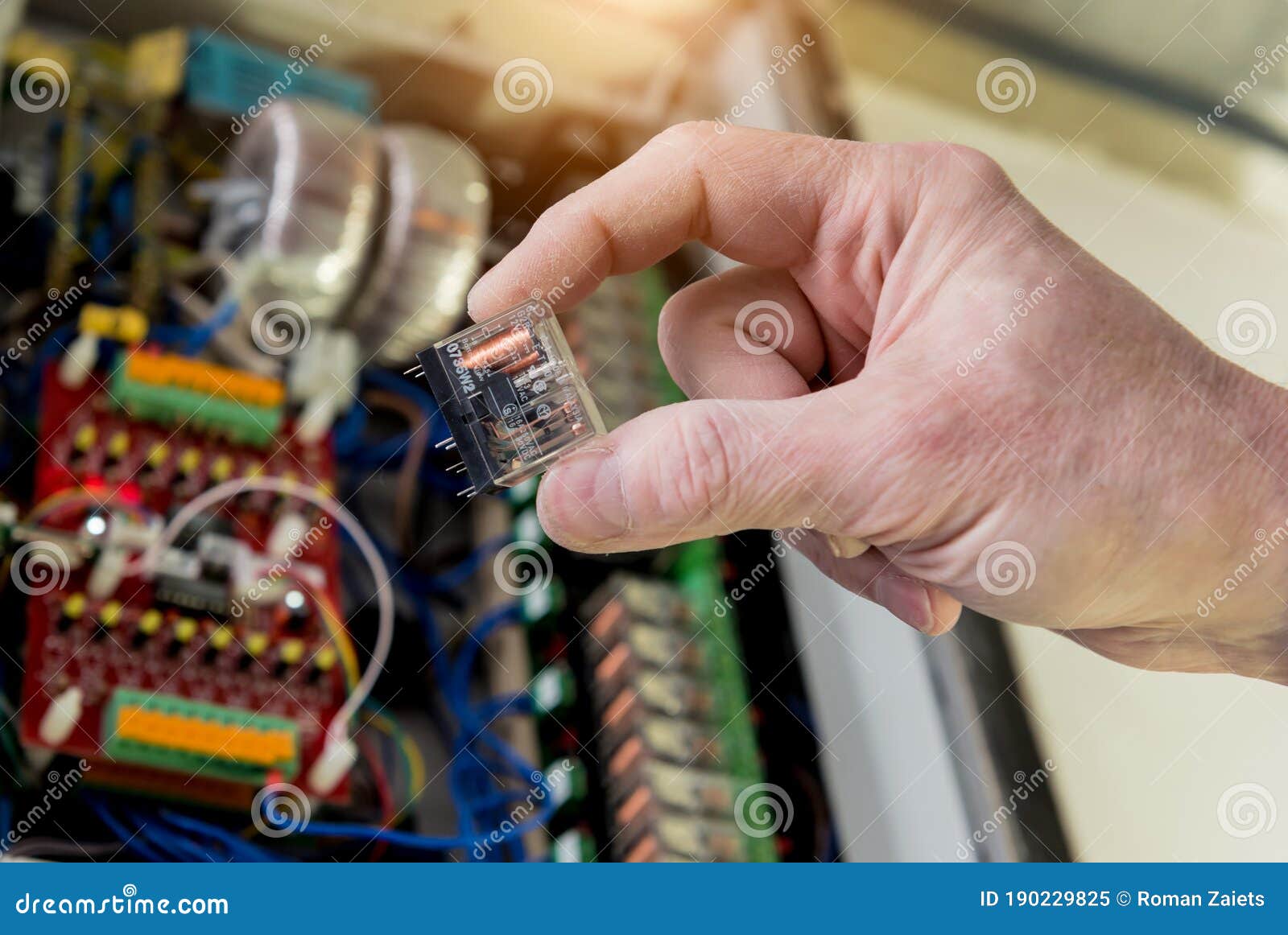 The Man is Repairing the Switchboard Voltage with Automatic Switches ...