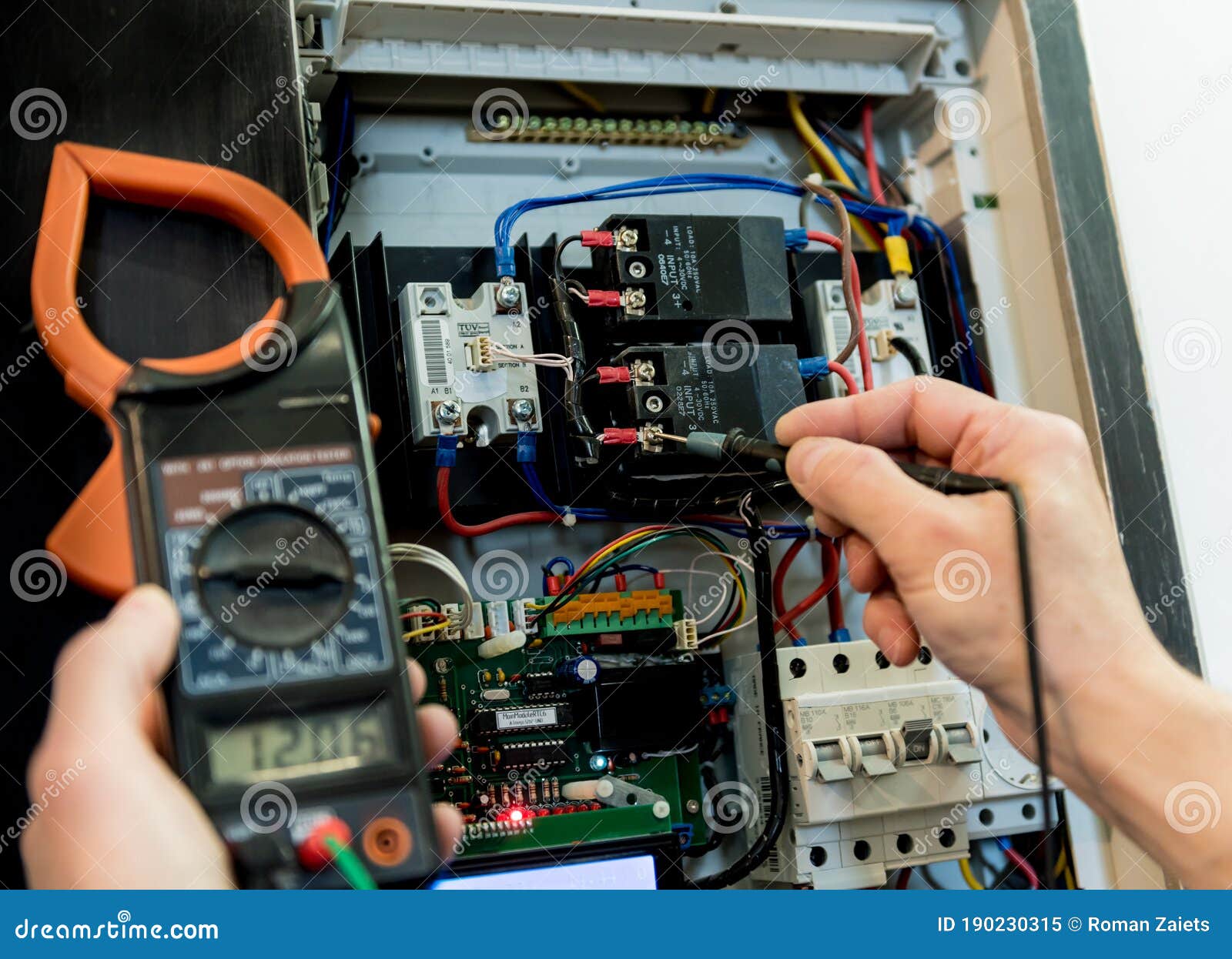 The Man is Repairing the Switchboard Voltage with Automatic Switches ...