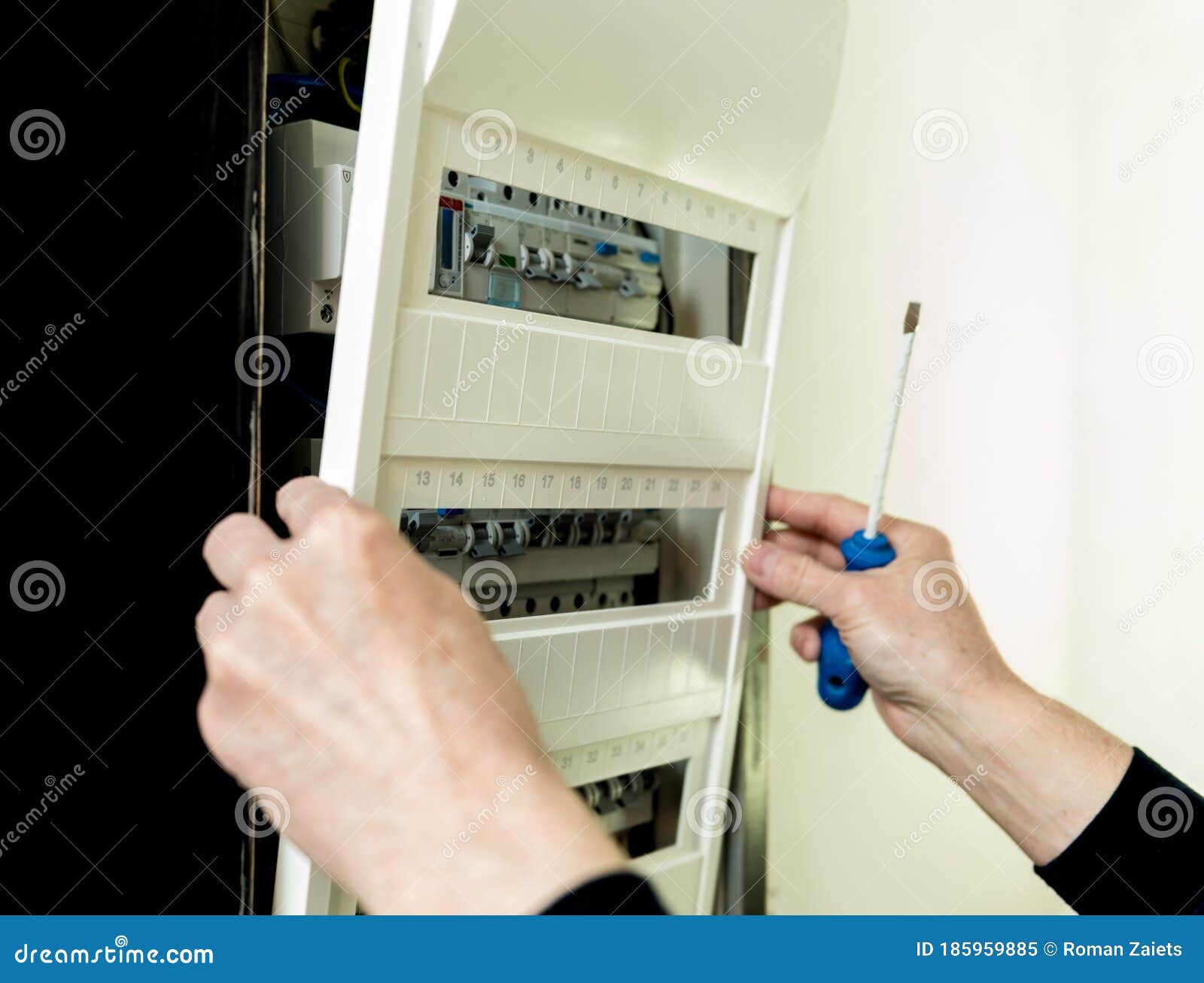 The Man is Repairing the Switchboard Voltage with Automatic Switches ...