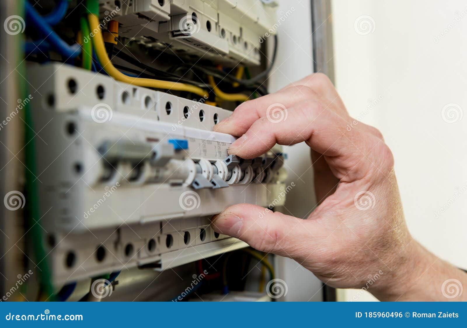 The Man is Repairing the Switchboard Voltage with Automatic Switches ...