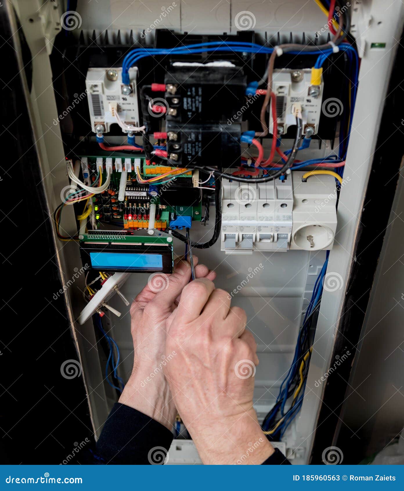 The Man is Repairing the Switchboard Voltage with Automatic Switches ...