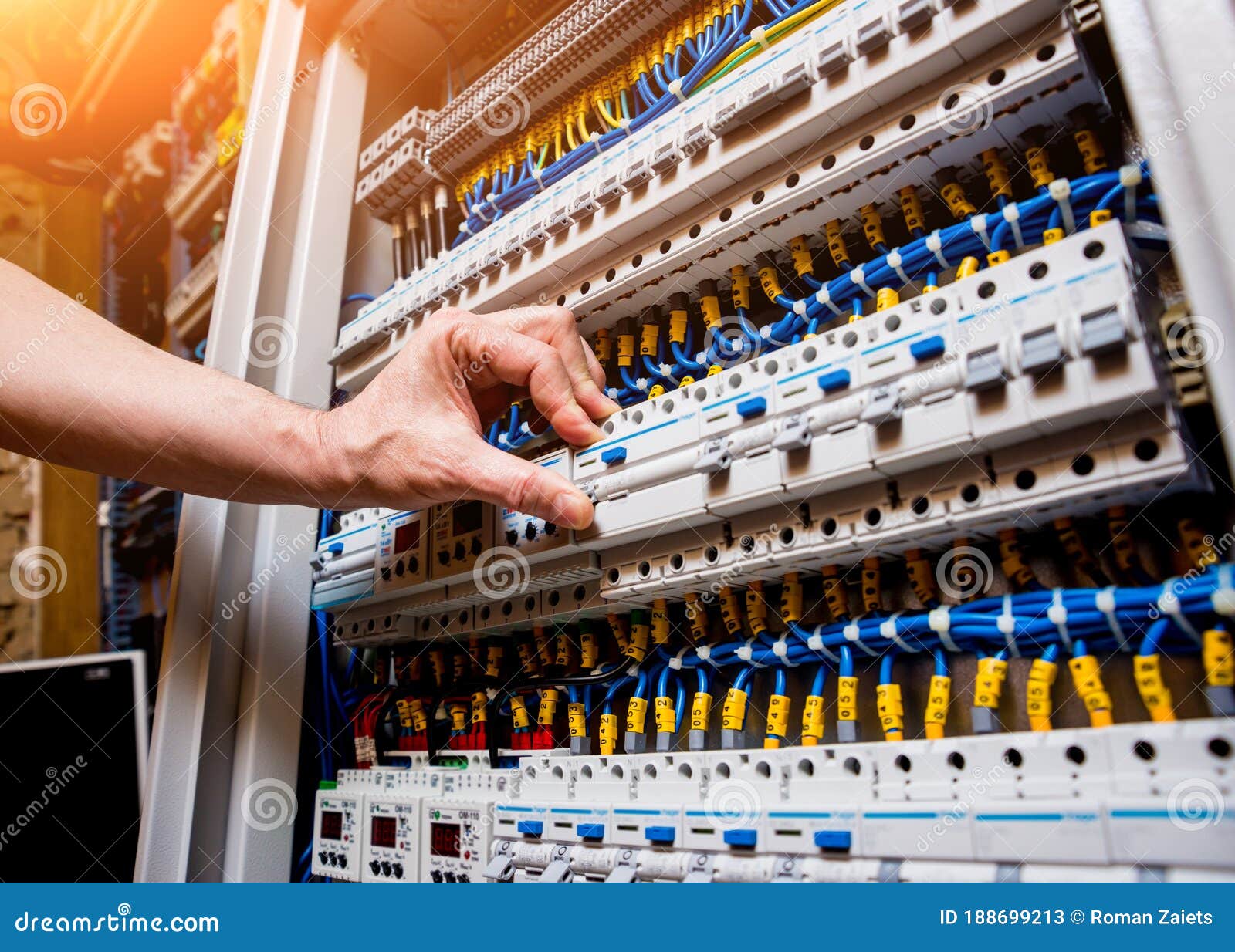 The Man is Repairing the Switchboard Voltage with Automatic Switches ...