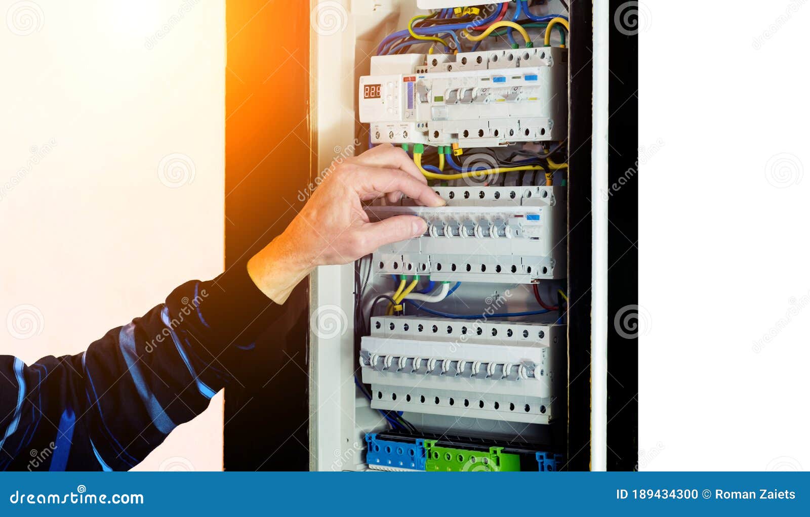 The Man is Repairing the Switchboard Voltage with Automatic Switches ...