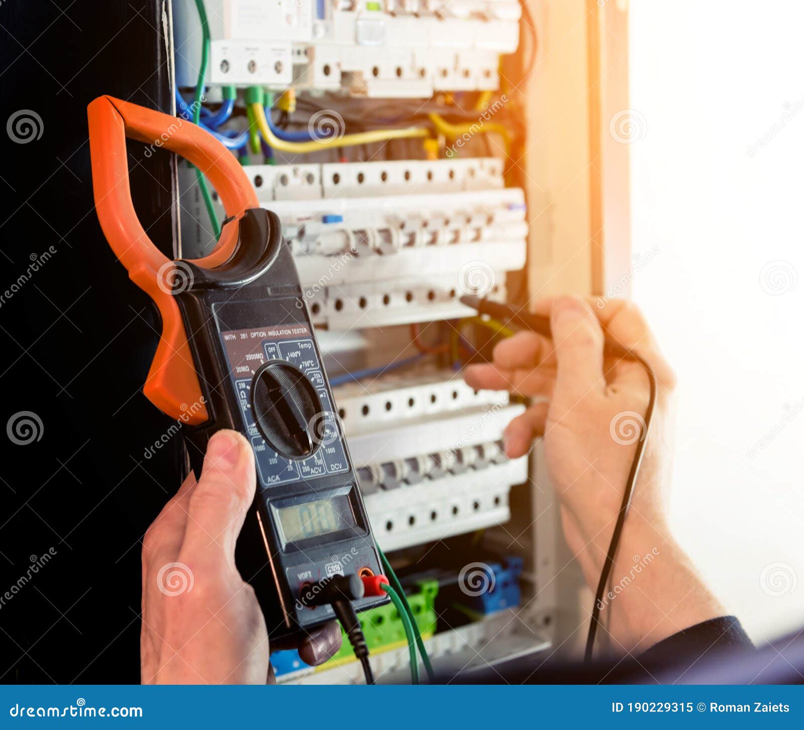 The Man is Repairing the Switchboard Voltage with Automatic Switches ...