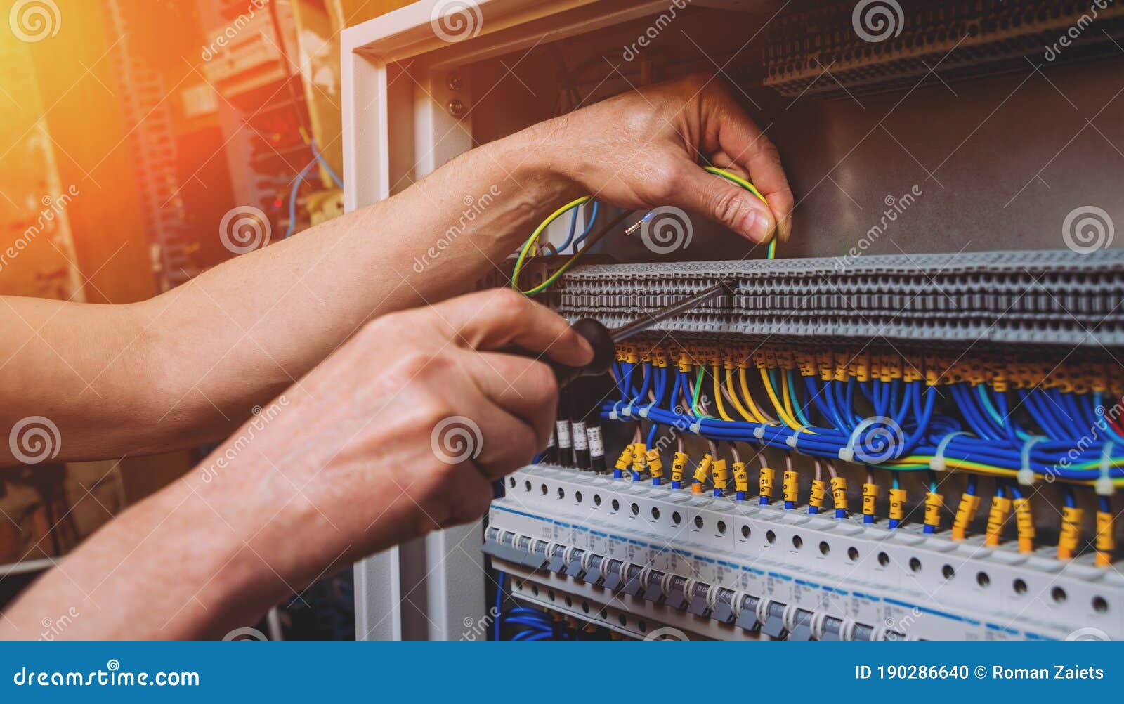 The Man is Repairing the Switchboard Voltage with Automatic Switches ...