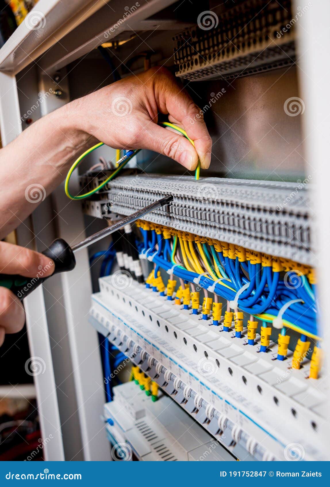 The Man is Repairing the Switchboard Voltage with Automatic Switches ...