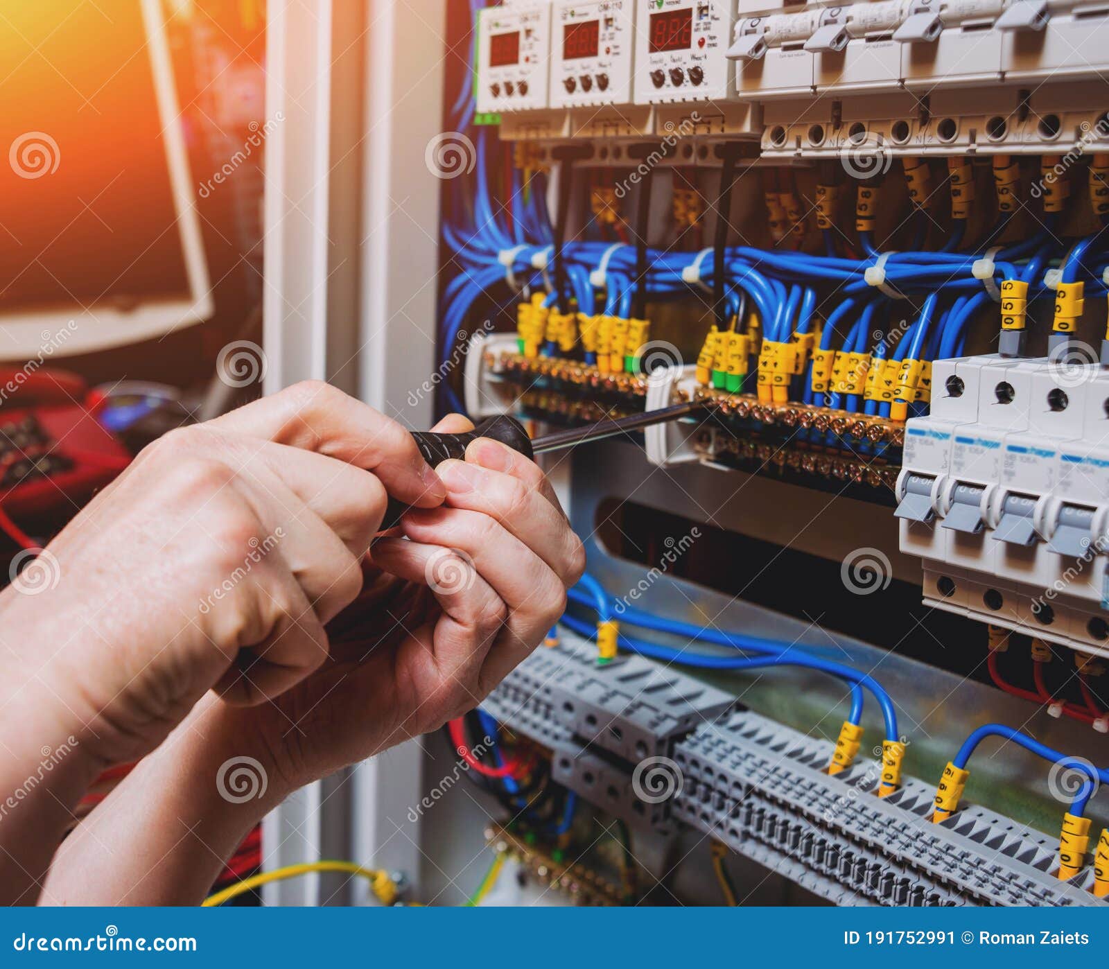 The Man is Repairing the Switchboard Voltage with Automatic Switches ...