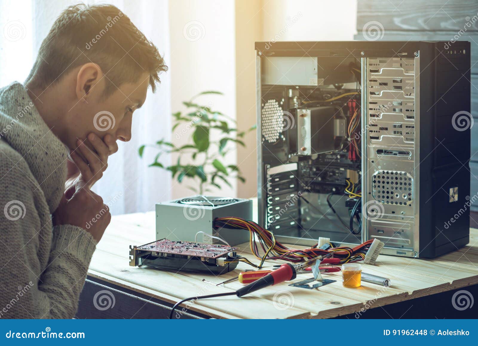Man Repairman is Trying To Fix Using the Tools on the Computer that is ...