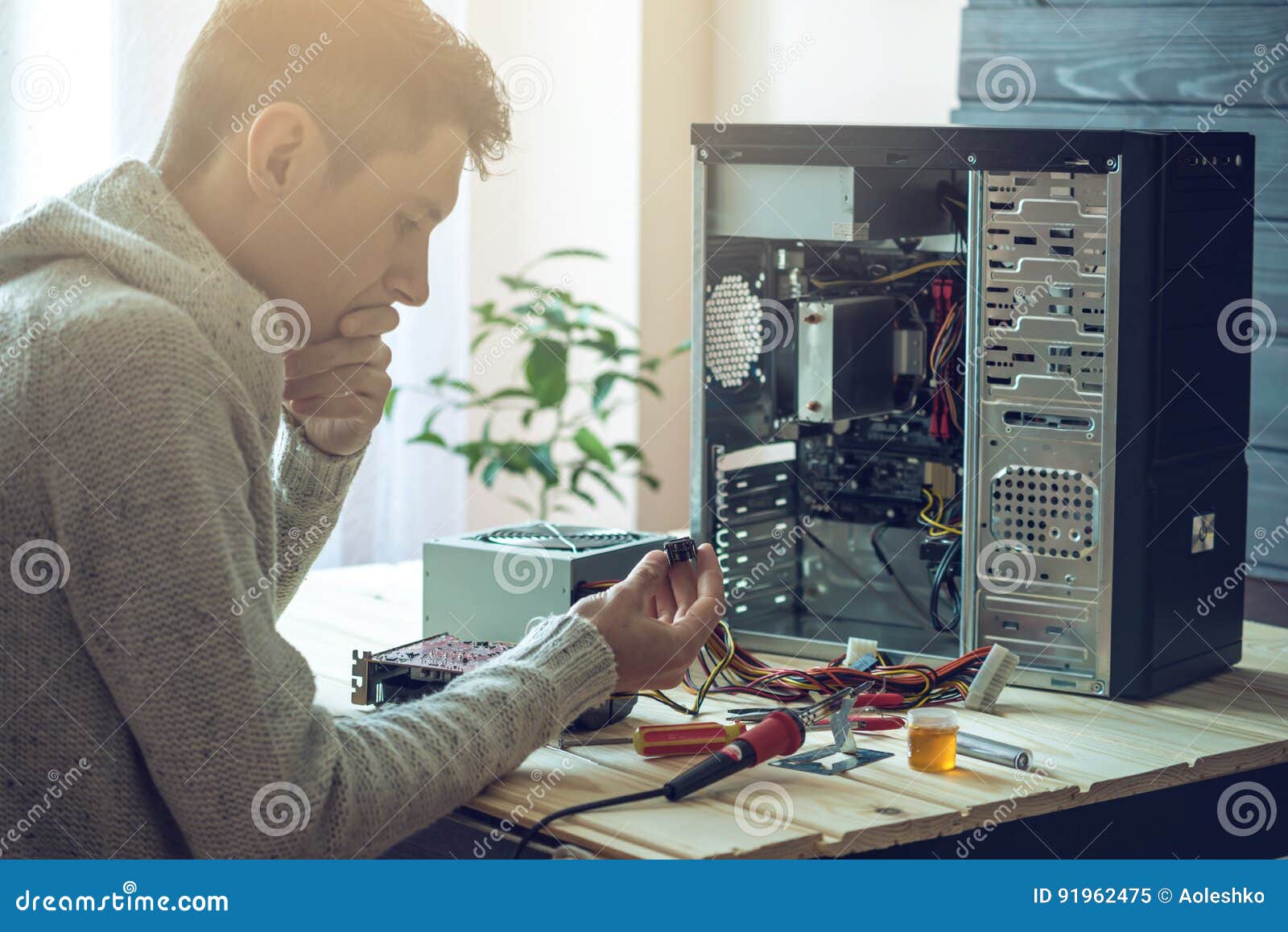 Man Repairman is Trying To Fix Using the Tools on the Computer that is ...