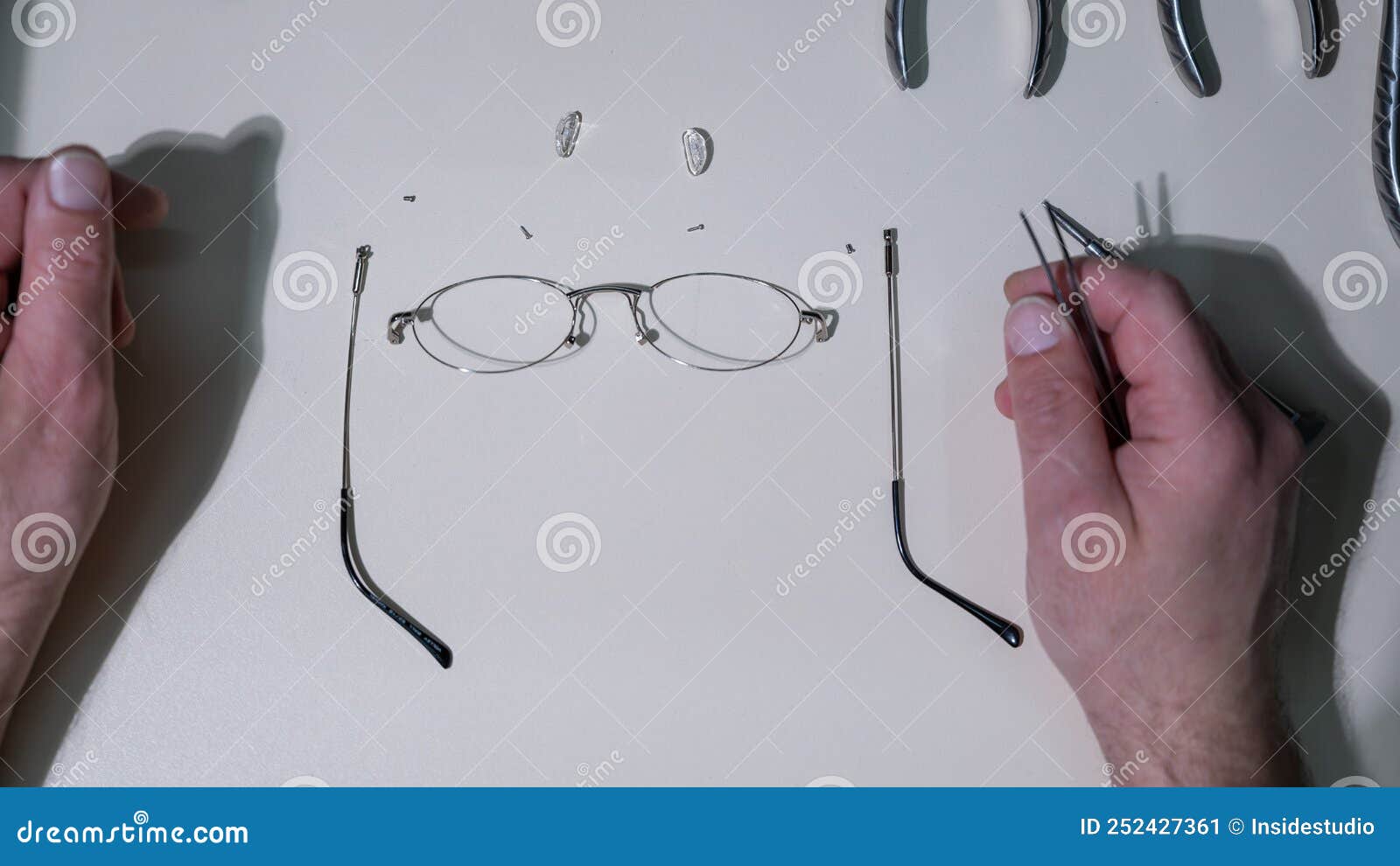 A Man Repairs a Broken Eyeglass Frame. Close-up of the Ophthalmologist ...