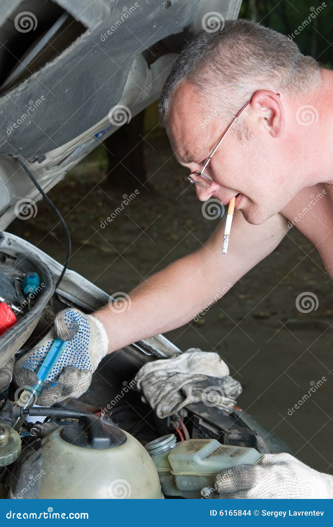 The man repairs car stock photo. Image of vehicle, repair - 6165844
