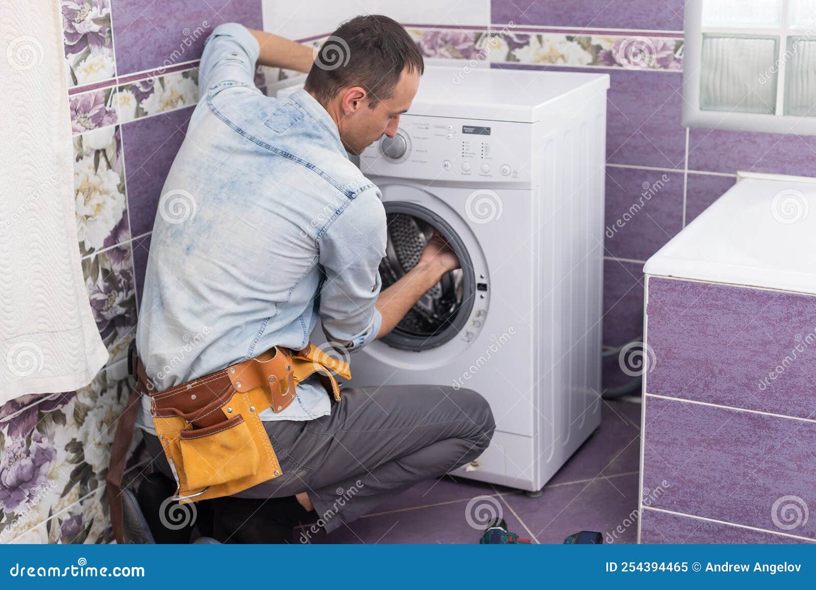 Man Repairs a Washing Machine Stock Image - Image of male, mechanical ...