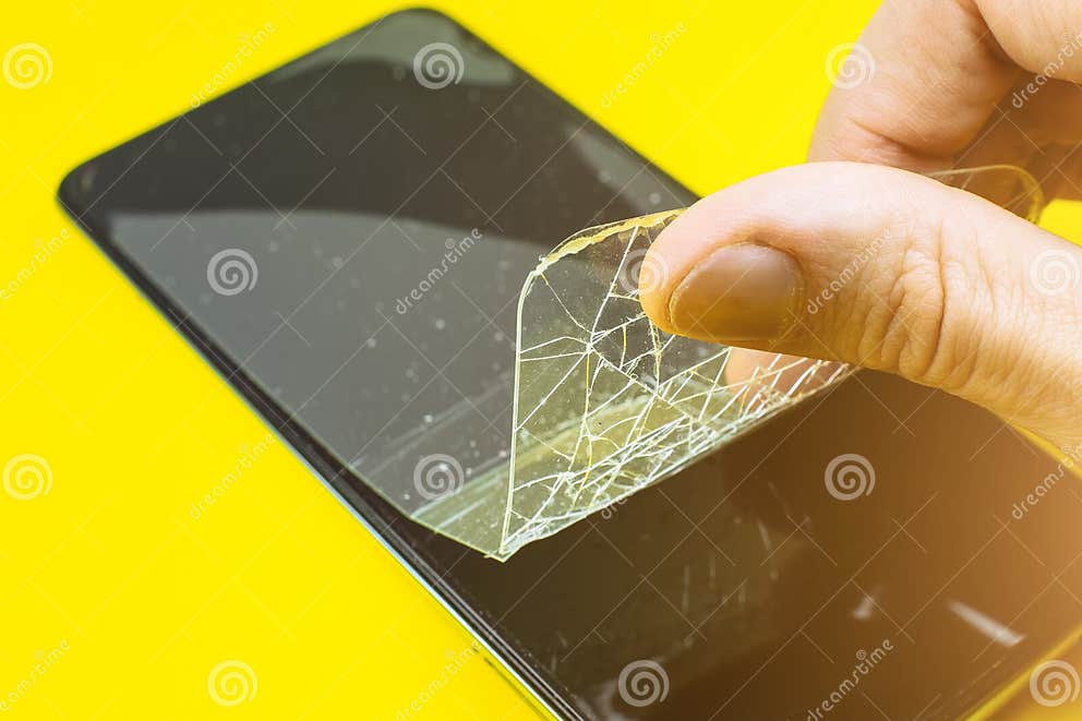 Man Replacing the Broken Tempered Glass Screen Protector. Crashed ...