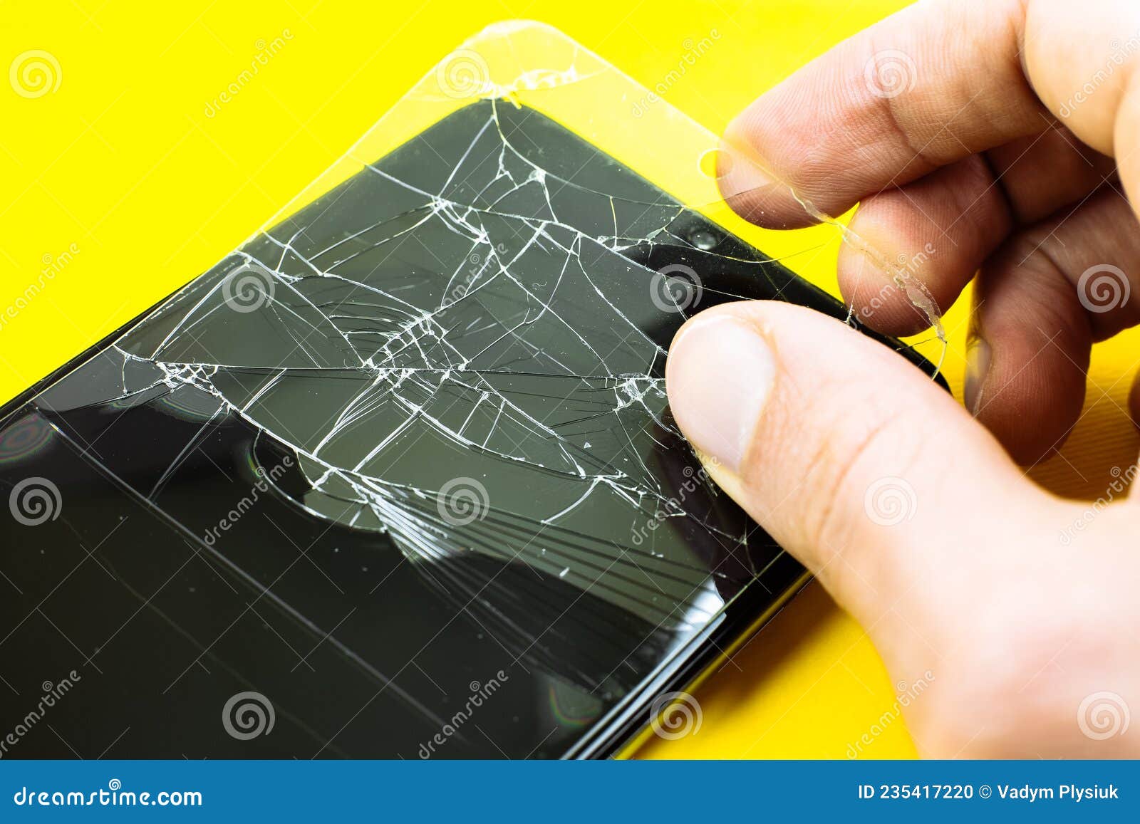 Man Replacing the Broken Tempered Glass Screen Protector. Crashed ...