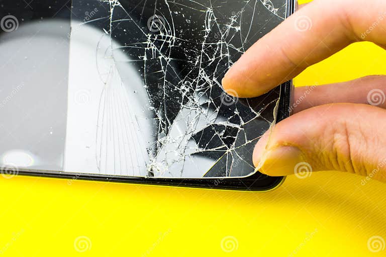Man Replacing the Broken Tempered Glass Screen Protector. Crashed ...