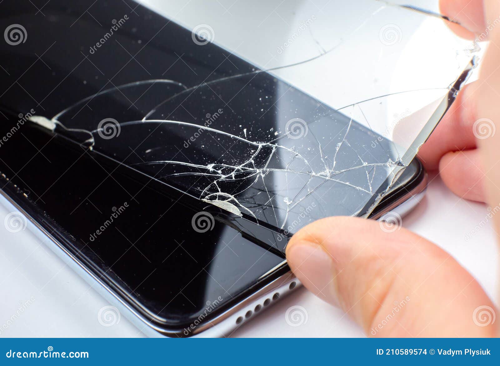 Man Replacing the Broken Tempered Glass Screen Protector for Smartphone ...