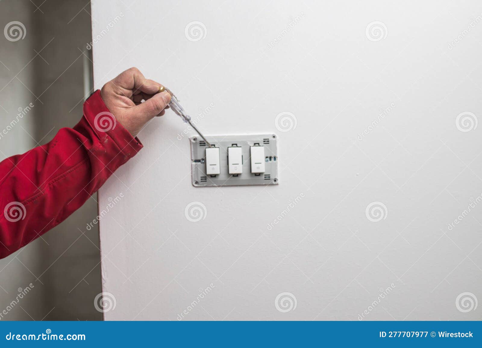 Man Replacing an Electrical Outlet on a White Wall Stock Image - Image ...
