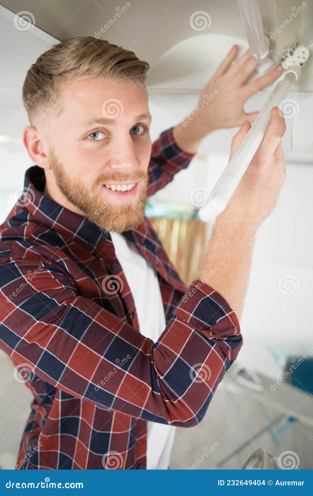 Man Replacing Light Bulb on Ceiling Stock Photo - Image of electrician ...