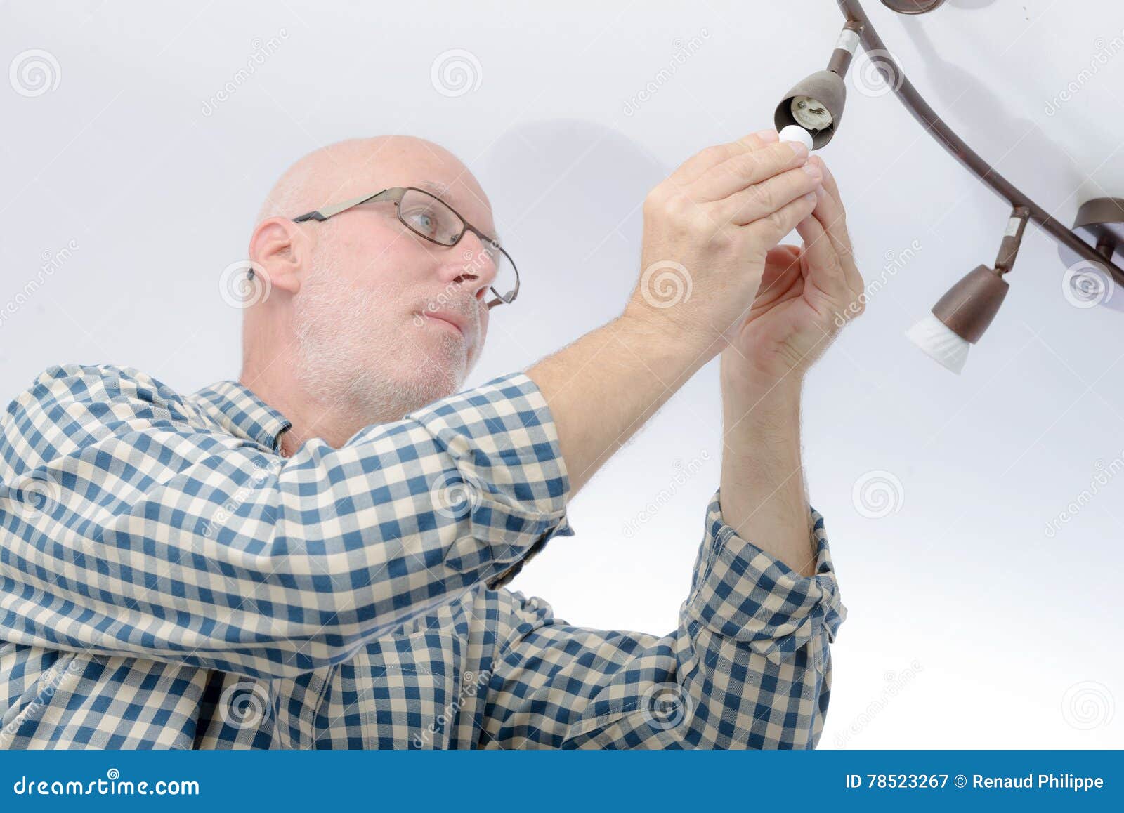 Man Replacing the Light Bulb at Home Stock Image - Image of house ...