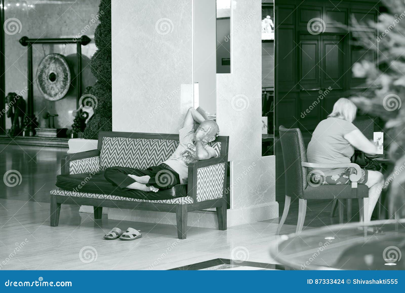 A man rest in hotel hall editorial stock image. Image of arrival - 87333424