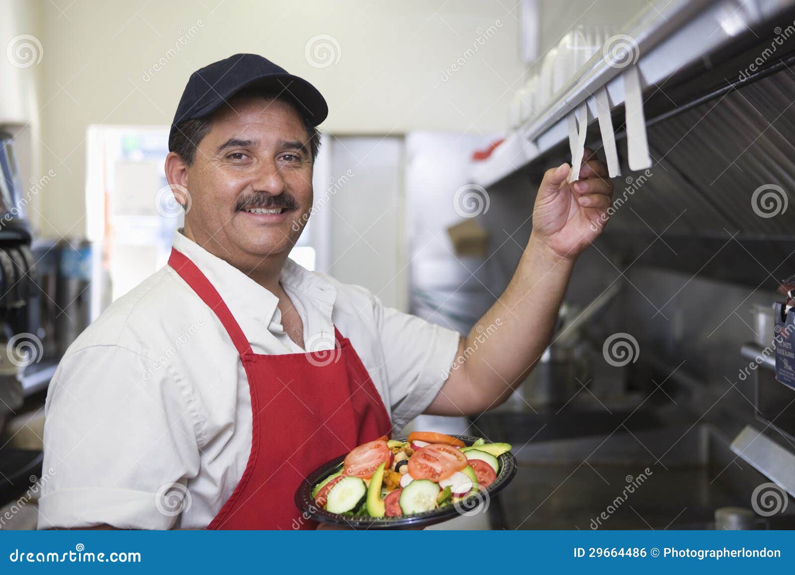 Man in Restaurant Kitchen stock photo. Image of eating - 29664486