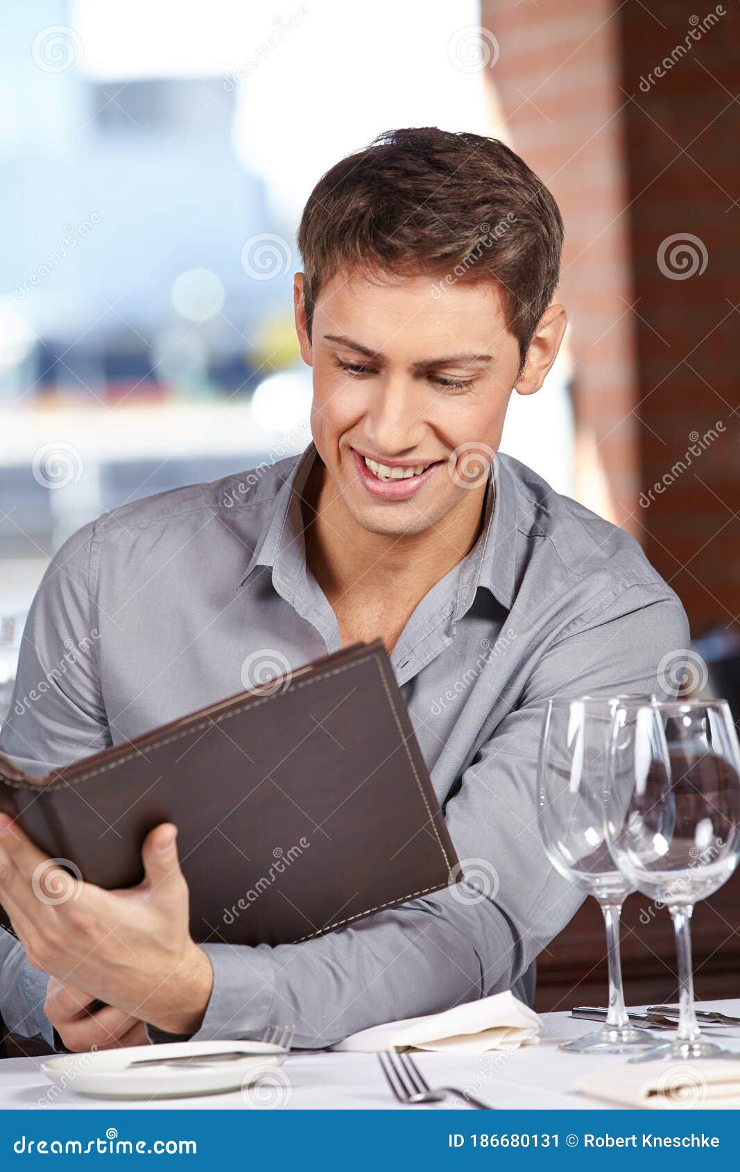 Man in Restaurant with Menu Stock Image - Image of decision, viewing ...