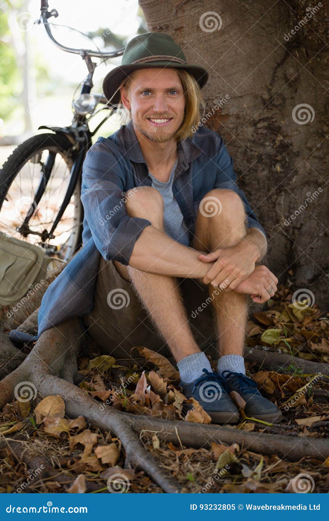 Man Resting Against a Tree in the Park Stock Image - Image of resting ...