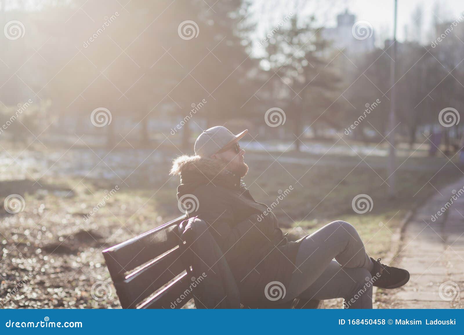 Man resting on a bench stock photo. Image of leisure - 168450458