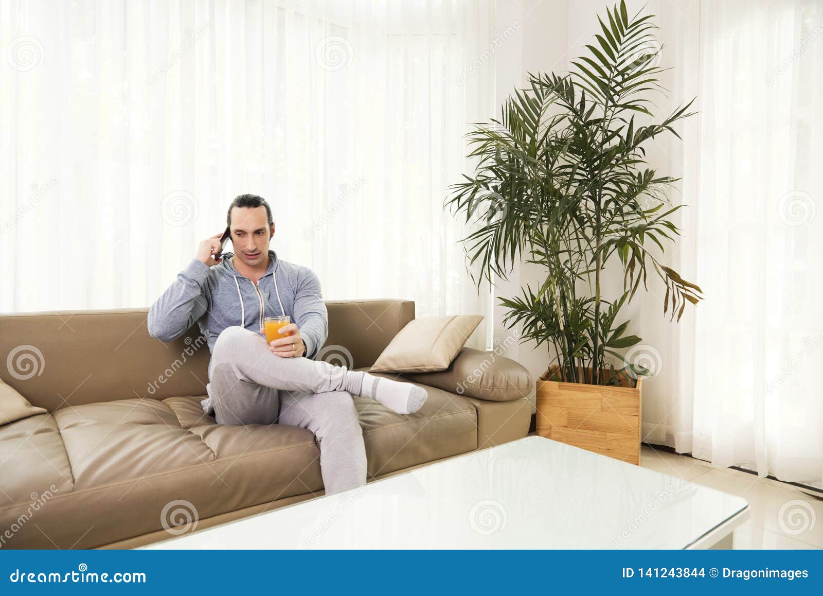 Man Resting at Home and Making Phone Call Stock Photo - Image of ...