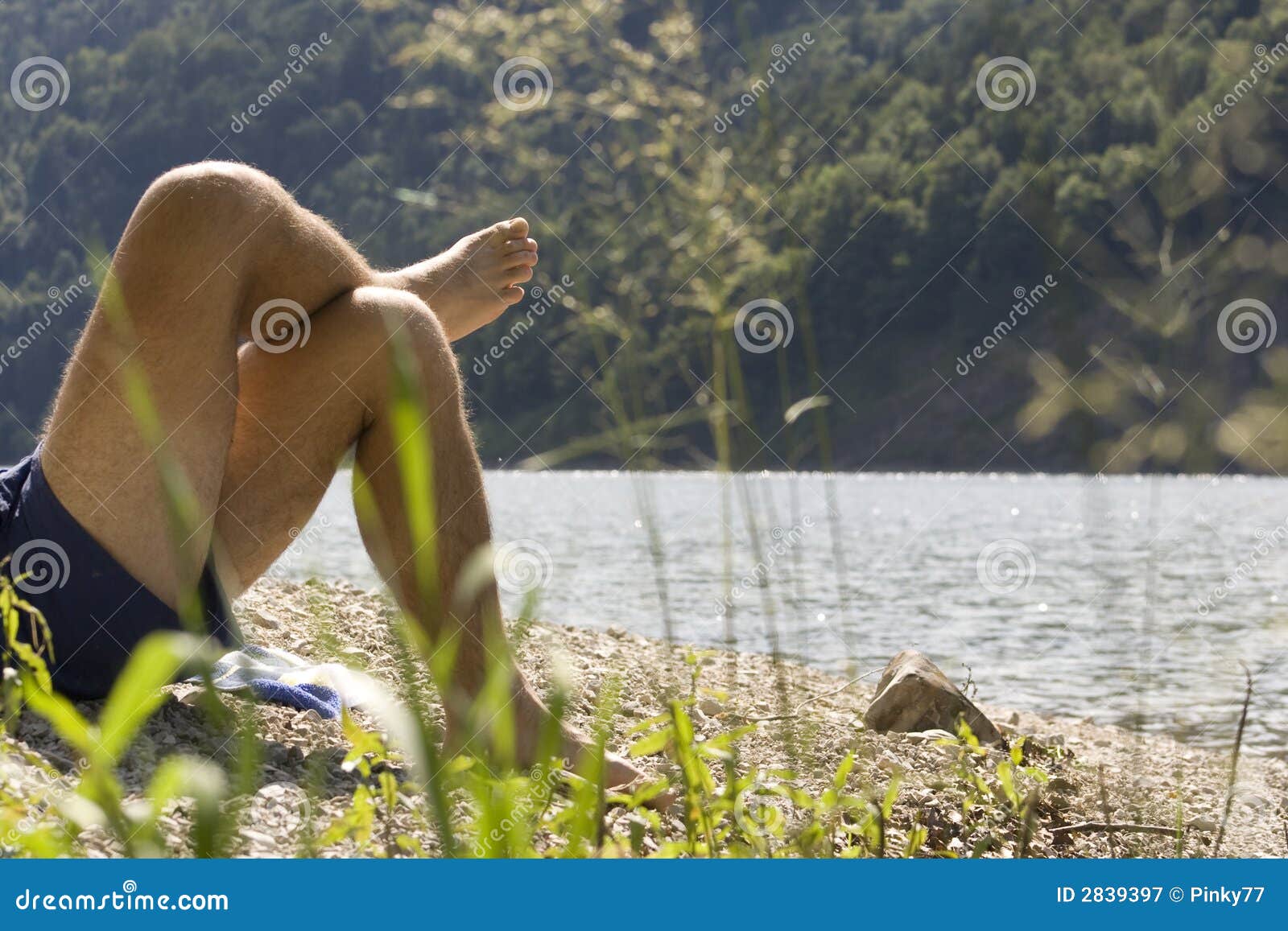 Man resting by lake stock image. Image of water, lakefront - 2839397