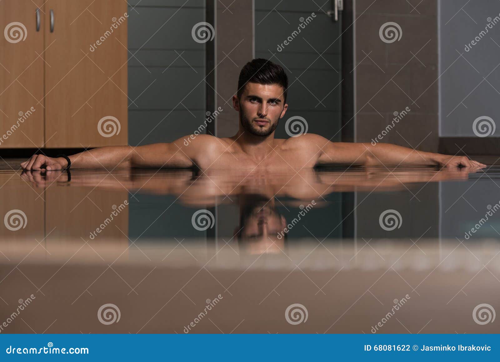 Man Resting Relaxed on Edge of Swimming Pool Stock Photo - Image of ...