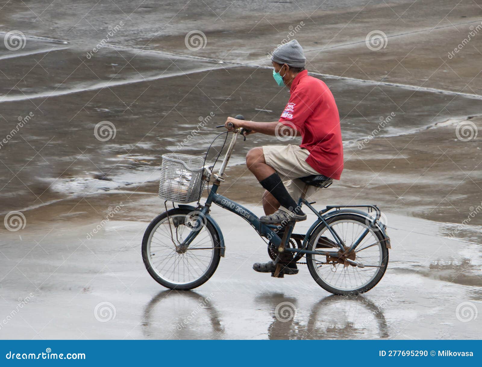 A Man Rides a Bicycle in the Rain Editorial Image - Image of biker ...