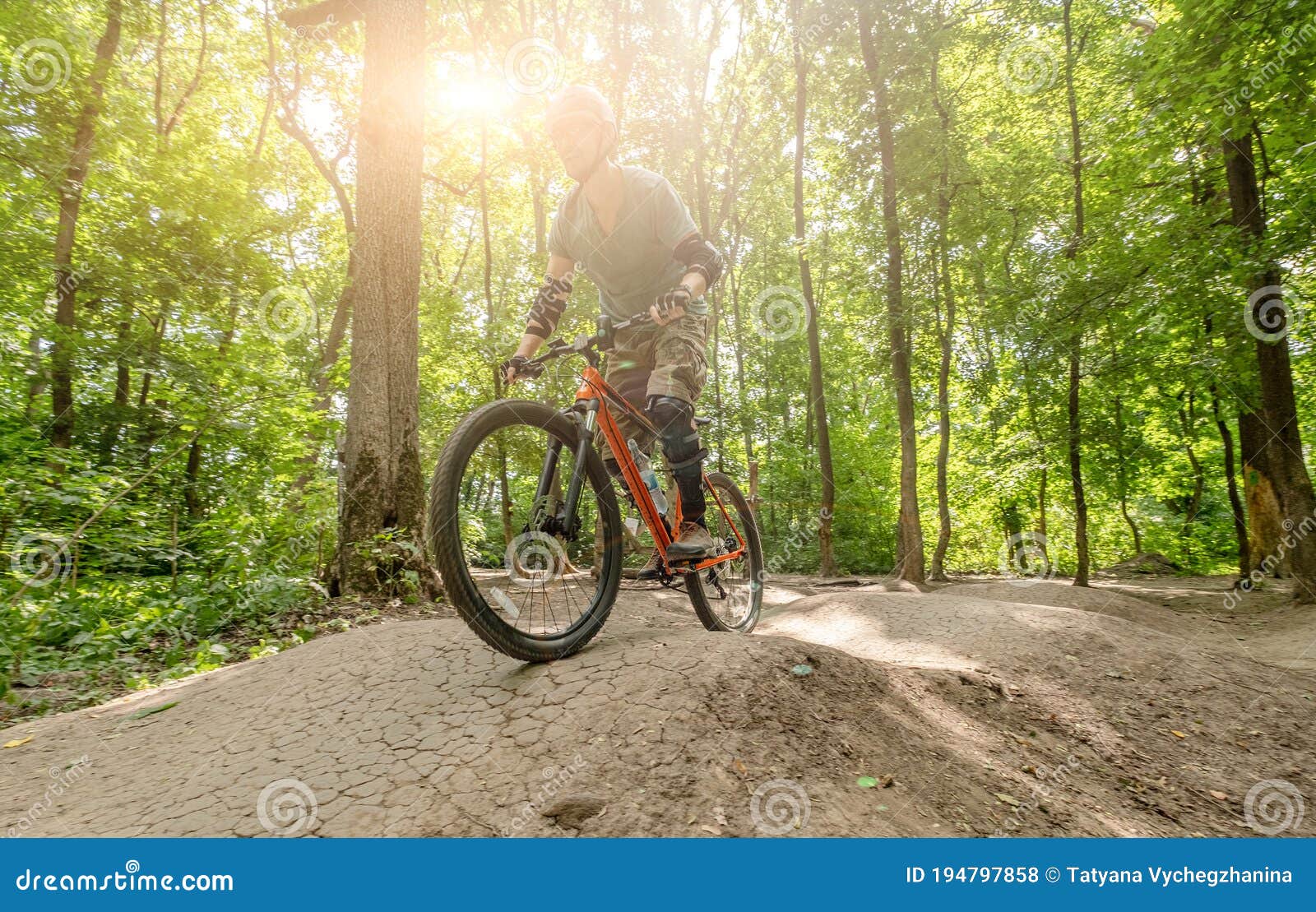 Man Riding Bicycle on Forest Road Stock Photo - Image of helmet, ride ...
