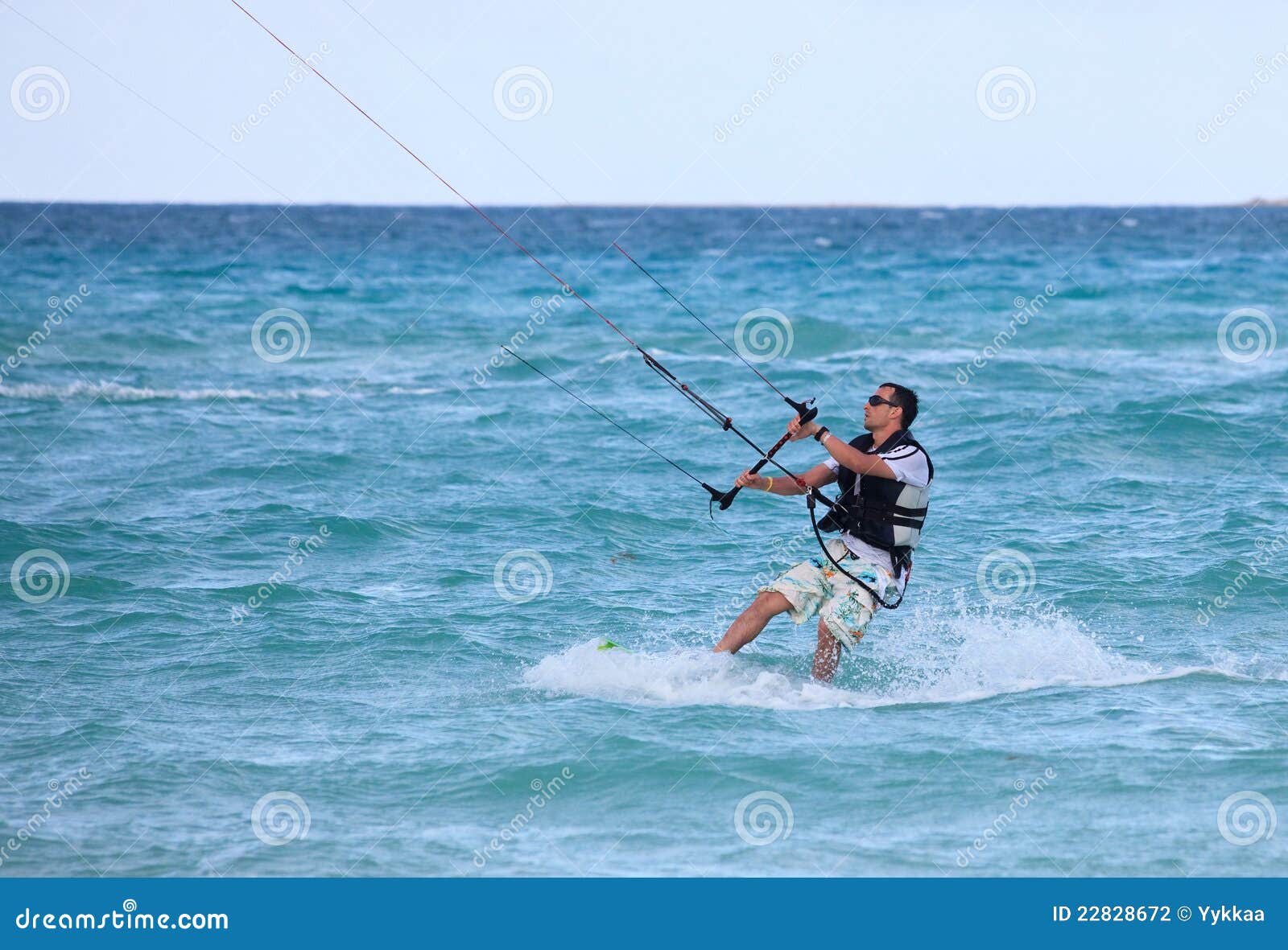 Man riding his kiteboard. stock photo. Image of passion - 22828672