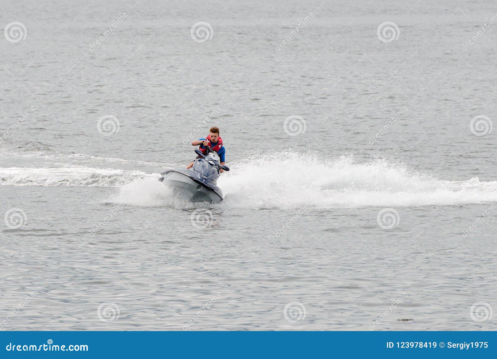 Man riding a jet ski stock image. Image of nautical - 123978419