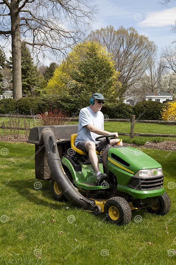 Man on Riding Lawn Mower editorial photo. Image of grass - 9034291