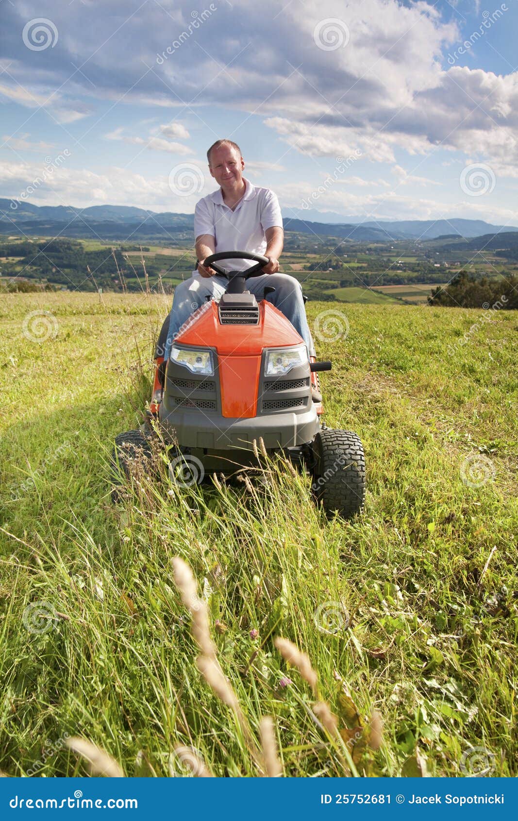 Man riding a lawn tractor stock image. Image of grass - 25752681