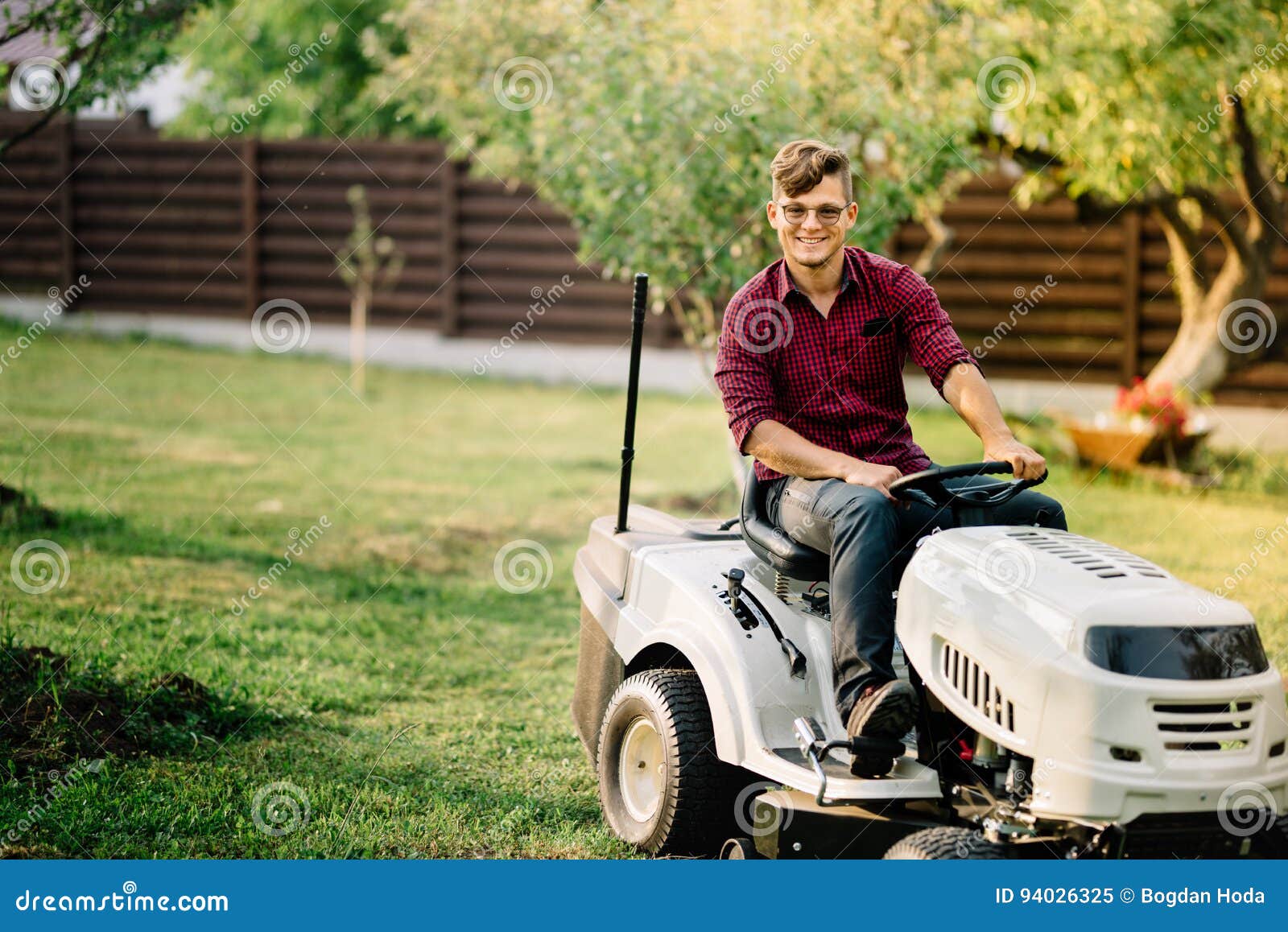 Man Riding a Lawnmower and Doing Landscaping Works Stock Image - Image ...