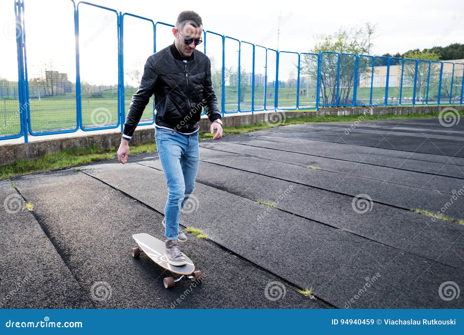 Man riding a long board stock image. Image of drive, board - 94940459