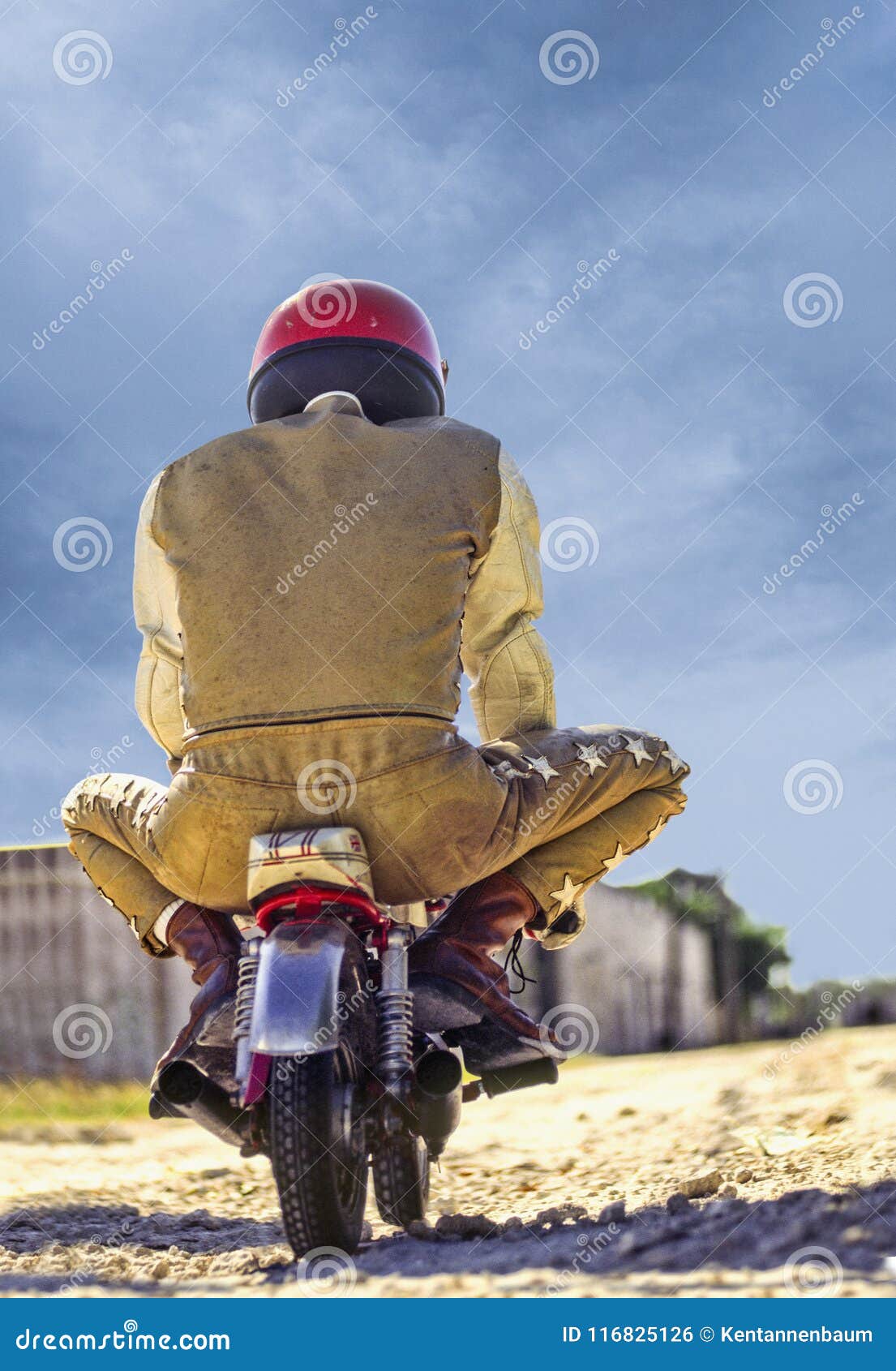 Man riding mini motorcycle stock photo. Image of road - 116825126
