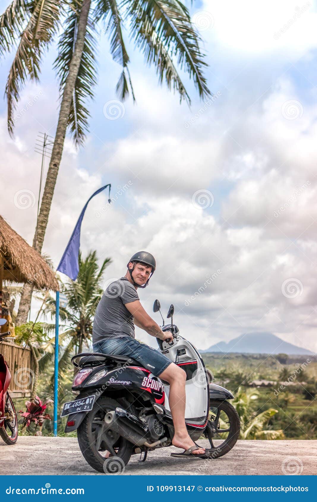 Man Riding Motor Scooter Picture. Image: 109913147