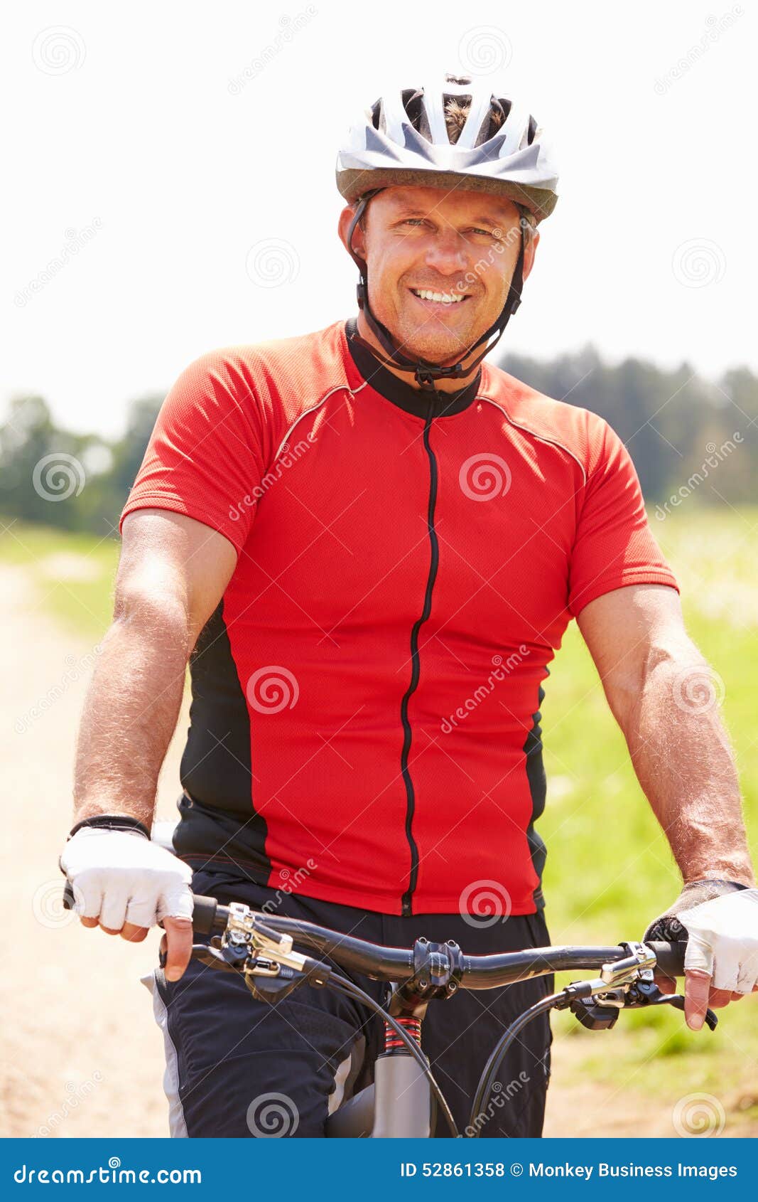 Man Riding Mountain Bike Along Path in Countryside Stock Photo - Image ...