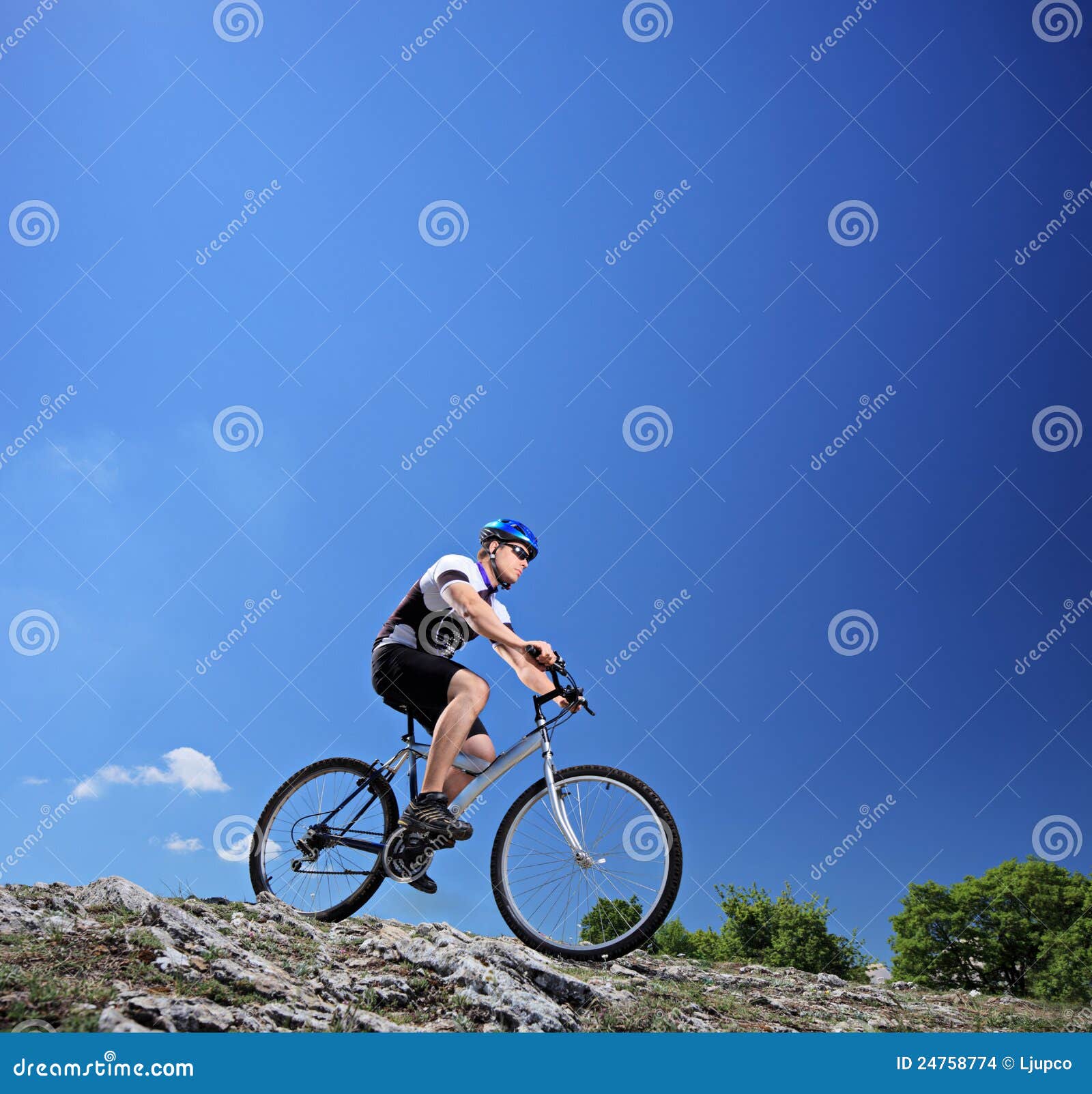 A Man Riding a Mountain Bike on a Slope Stock Photo - Image of motion ...