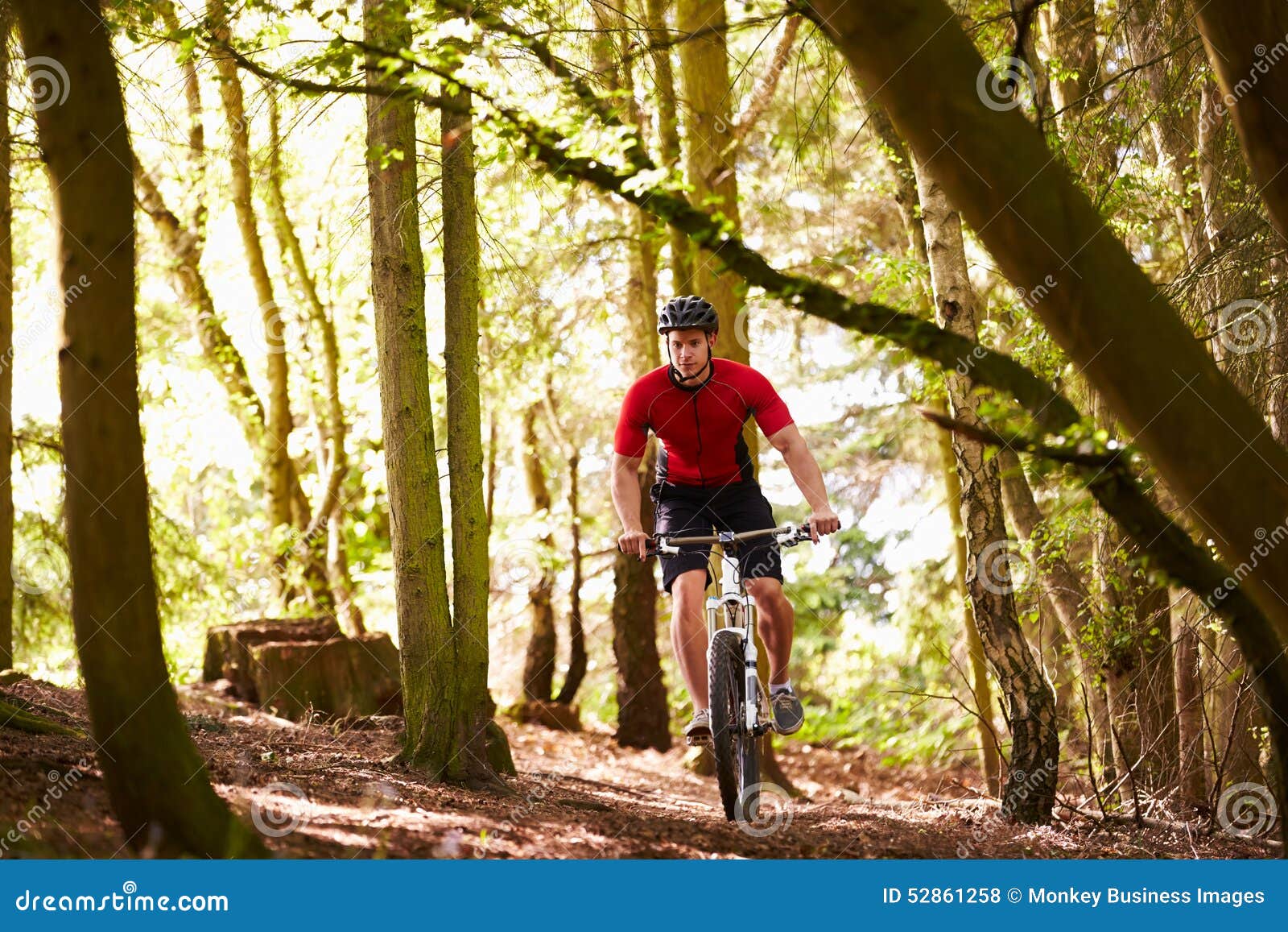 Man Riding Mountain Bike through Woods Stock Photo - Image of countryside, exercising: 52861258