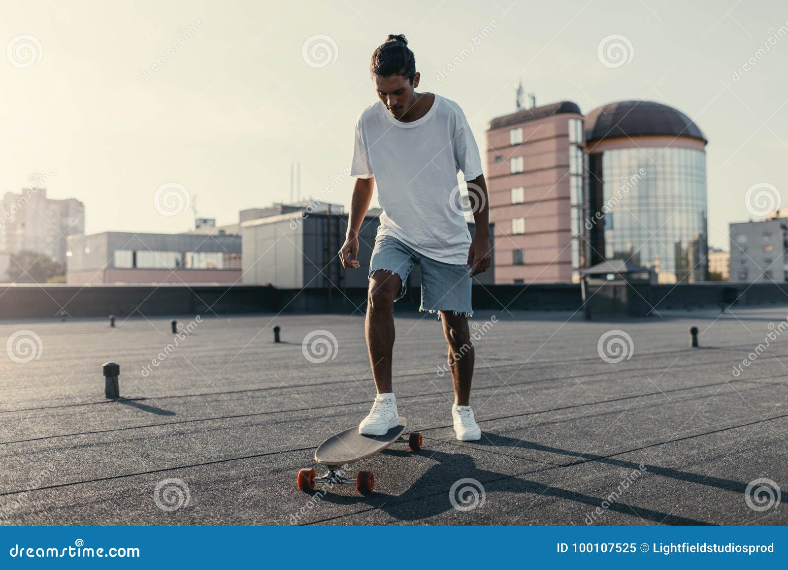 Man Riding on Skateboard on Rooftop Stock Image - Image of male, skater ...