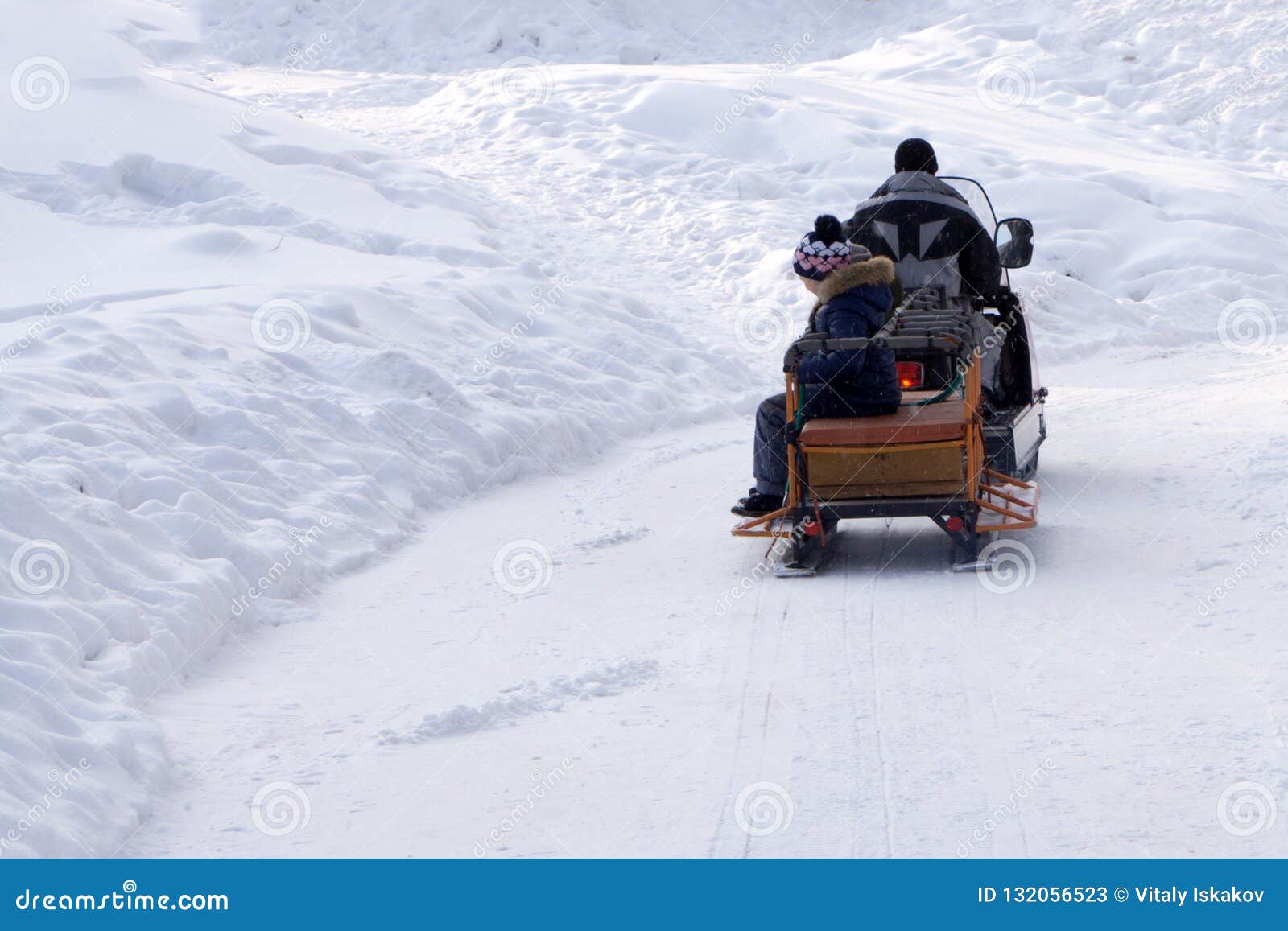 A Man Riding on a Snowmobile with the Kids Stock Image - Image of ...